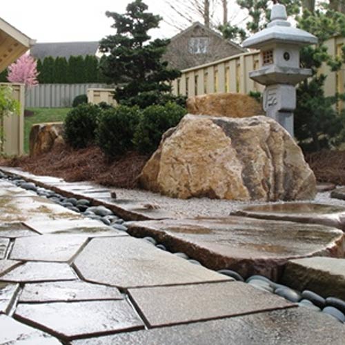 Boulder And Custom Stone Wall Landscaping Design And Installation